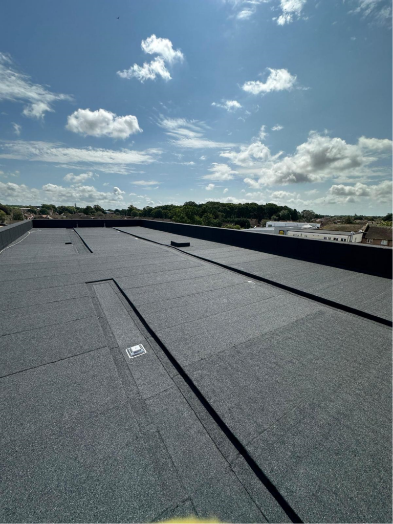 Thermal upgrade to flat roof of residential block in Havant - Rapleys